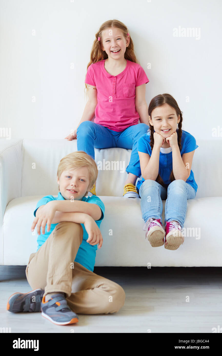 Three little friends looking at camera with smiles Stock Photo - Alamy