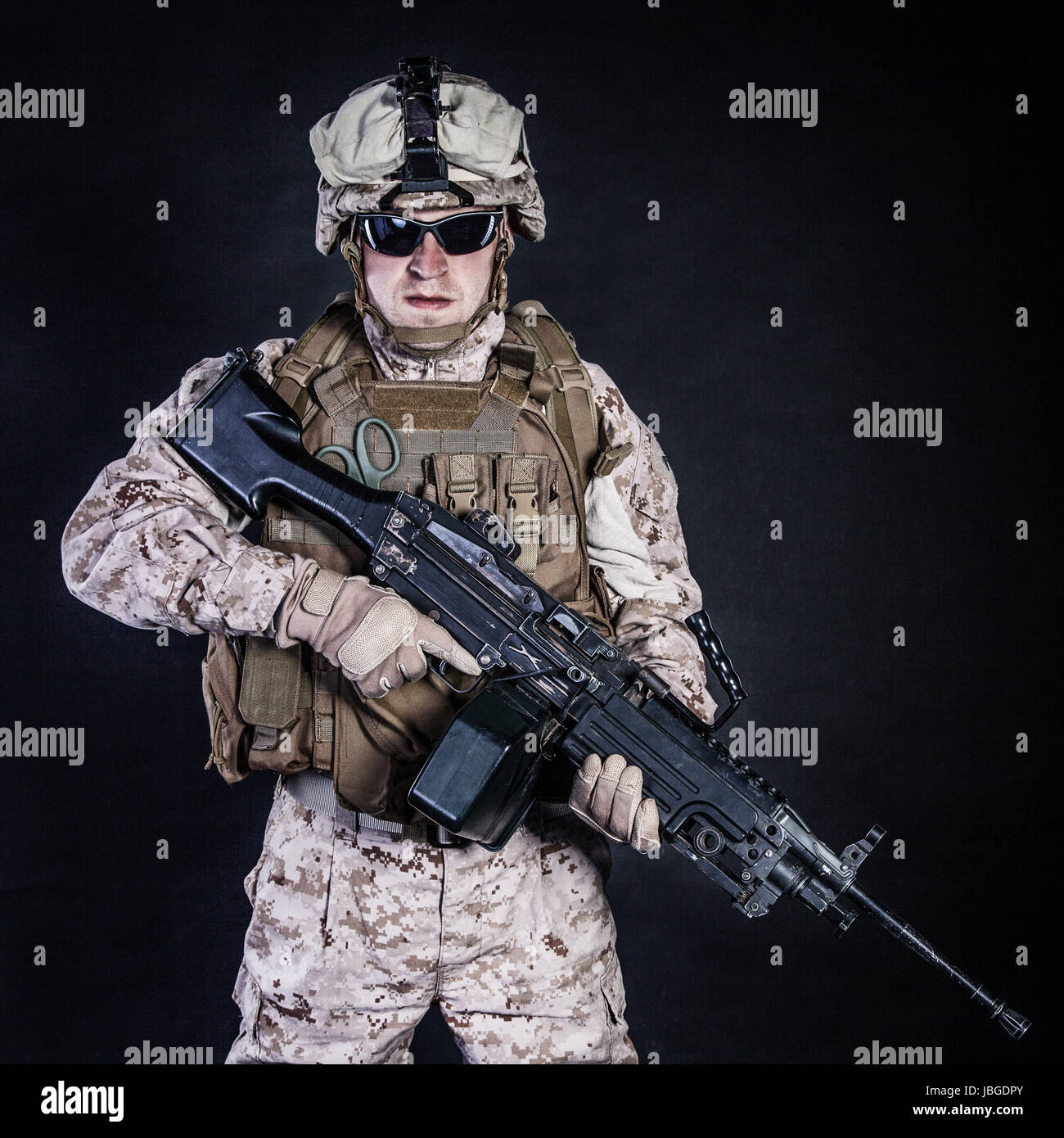 US marine with his assault rifle on black background Stock Photo - Alamy