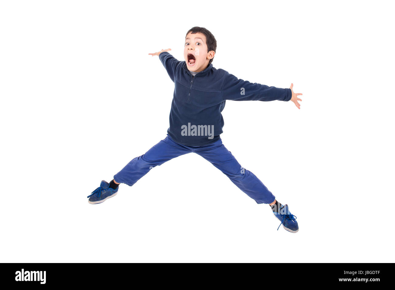 Young boy jumping isolated in white Stock Photo - Alamy