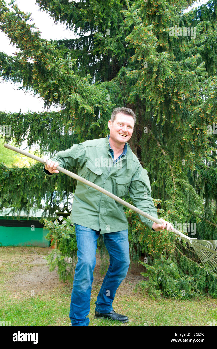 man with rake Stock Photo - Alamy