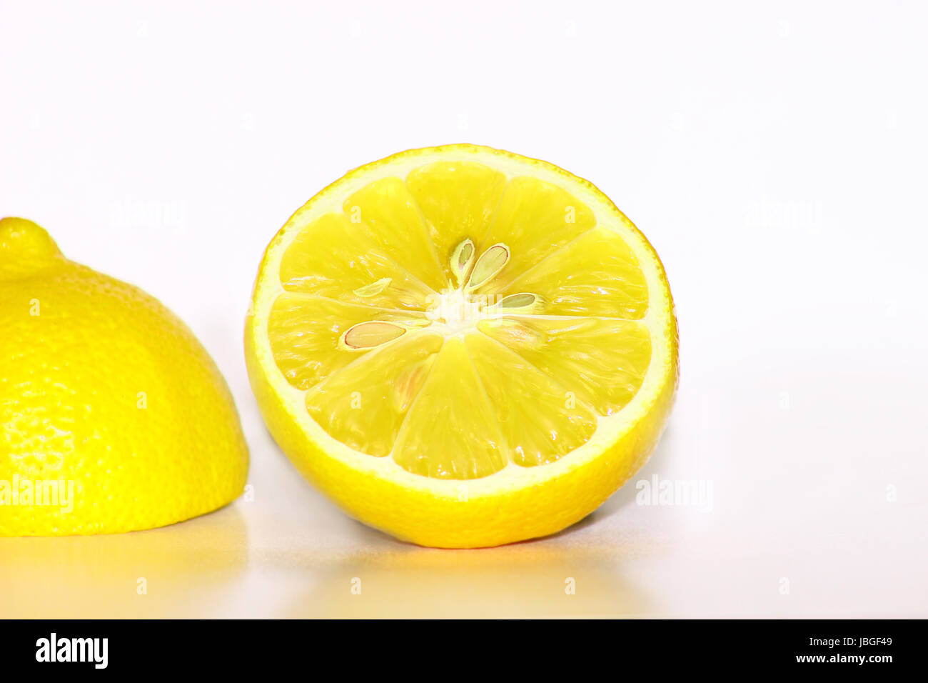 Close up of fresh and wet lemons isolated on white background Stock ...