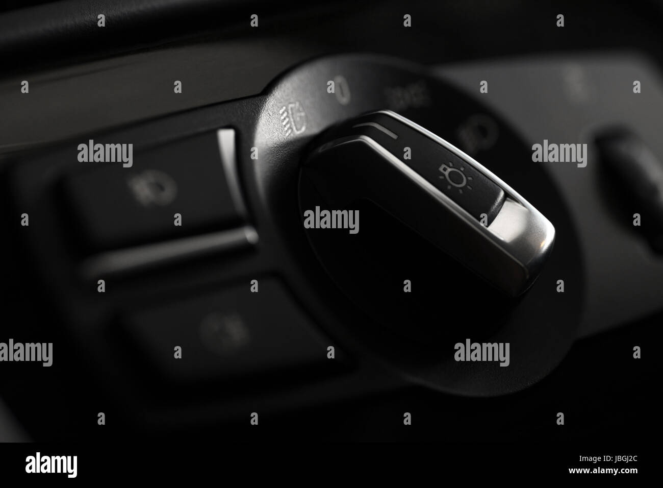 Detail of the headlight button in a car Stock Photo - Alamy