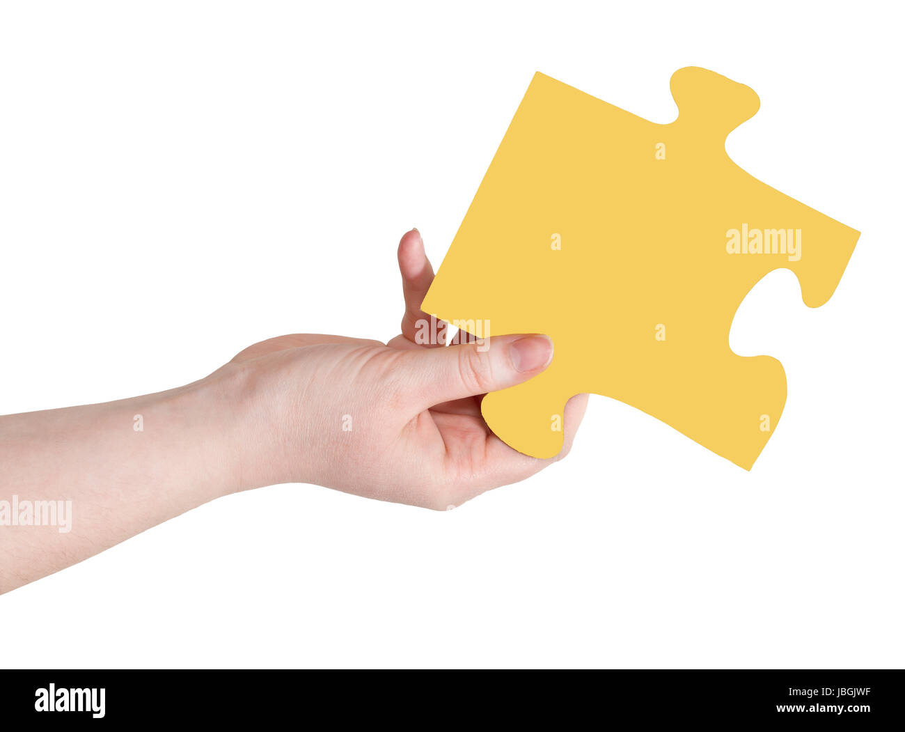 Hand holding puzzle piece Cut Out Stock Images & Pictures - Alamy