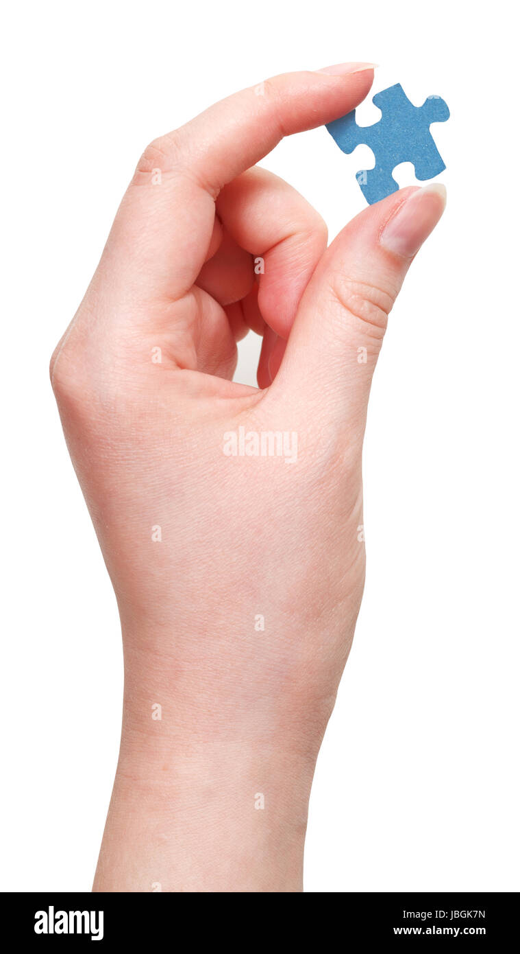 female hand holding blue puzzle piece isolated on white background ...