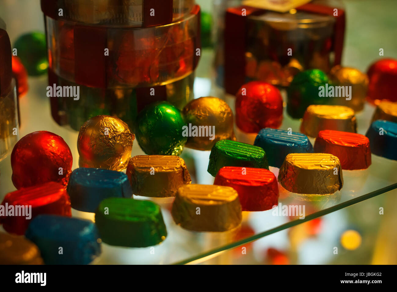 Sweet chocolate candy wrapped in foil Stock Photo - Alamy