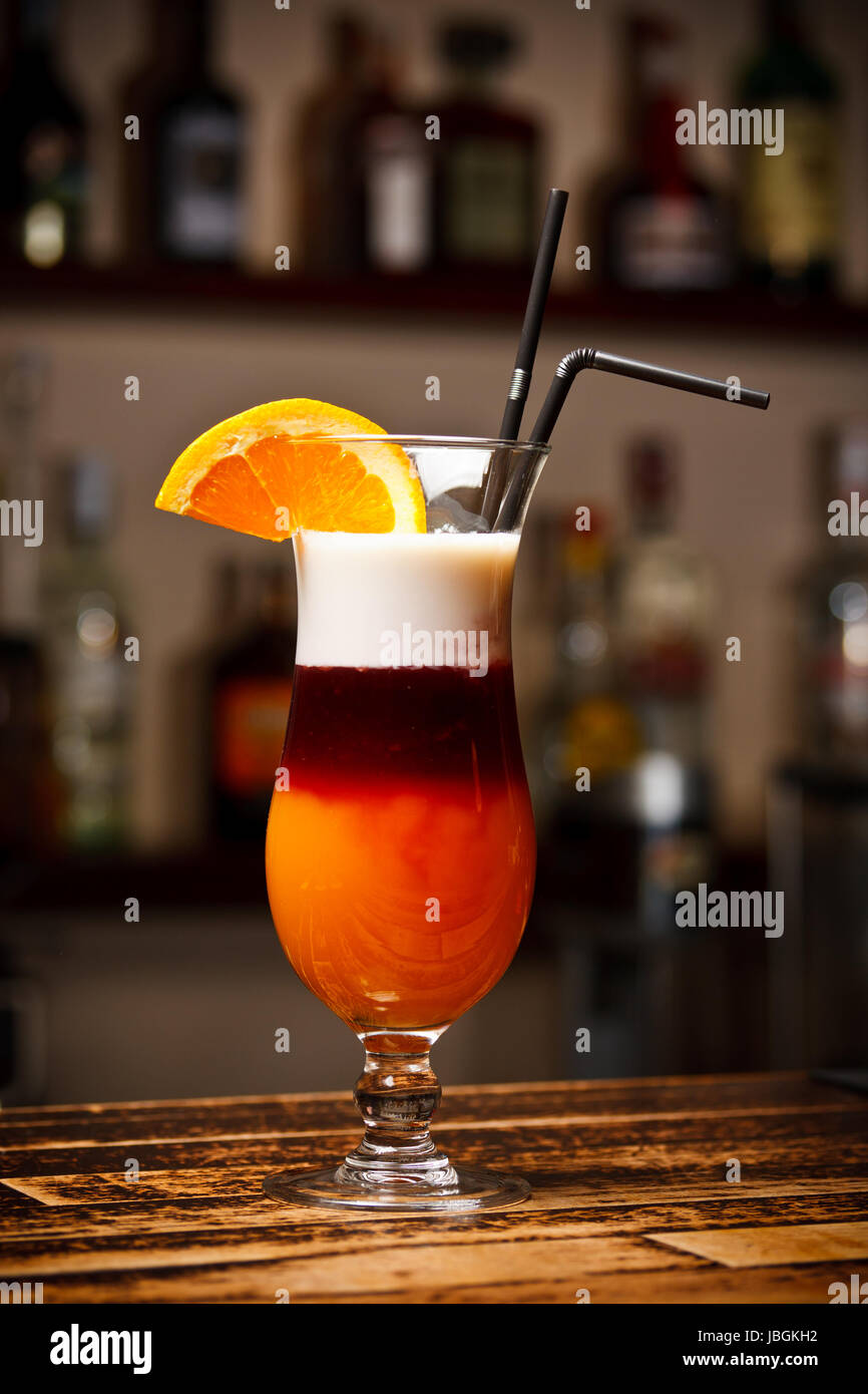 cocktail with orange on bar table Stock Photo - Alamy