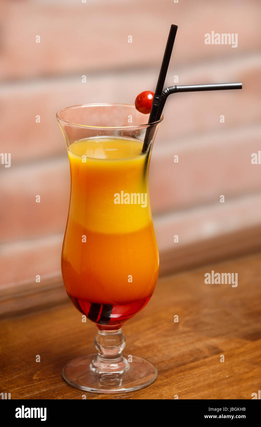 Nice three-layered cocktail on bar table Stock Photo - Alamy