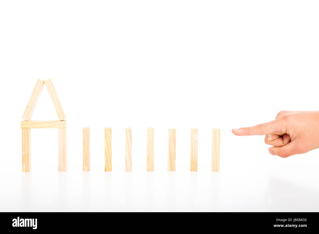 Finger pushing dominoes hi-res stock photography and images - Alamy