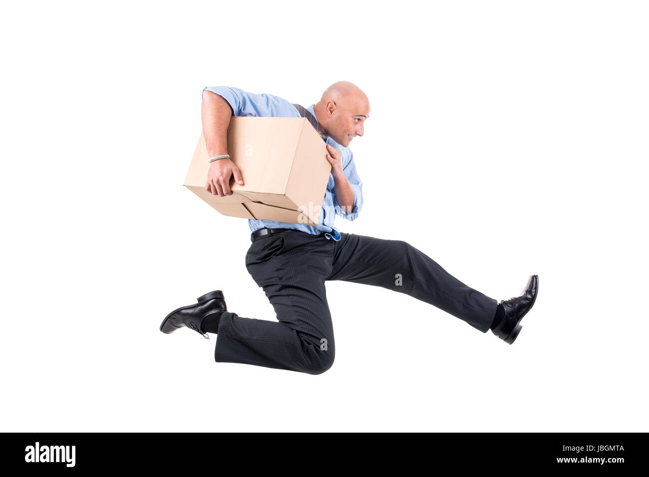 Businessman running with cardboard boxes Stock Photo - Alamy
