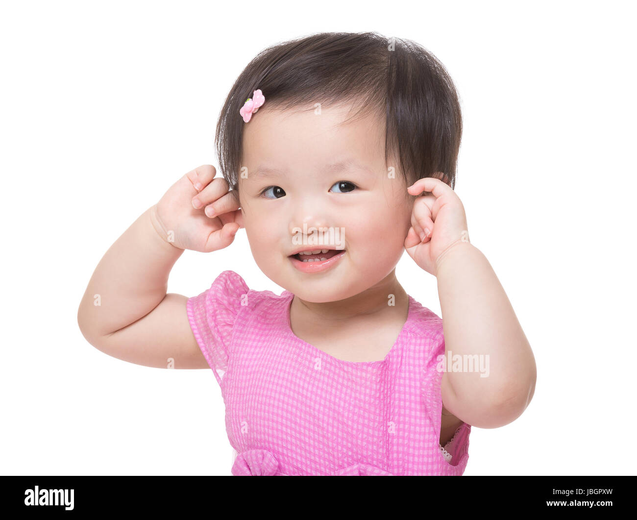 Asian baby girl two hands touch her ear Stock Photo - Alamy