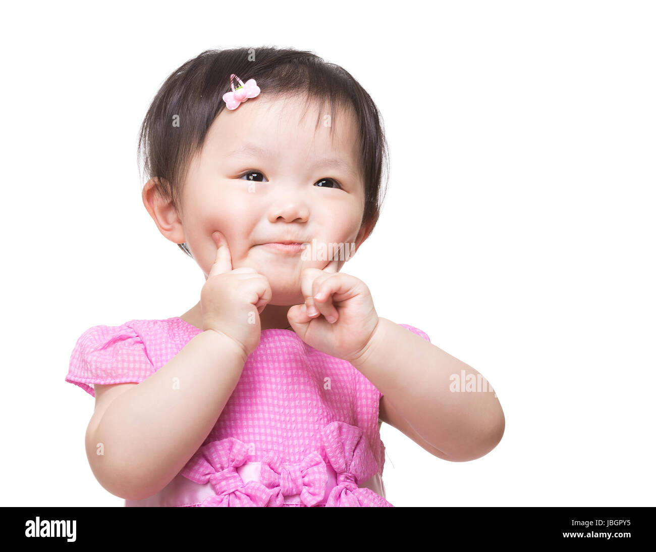 Asian baby girl two fingers touch her face Stock Photo - Alamy