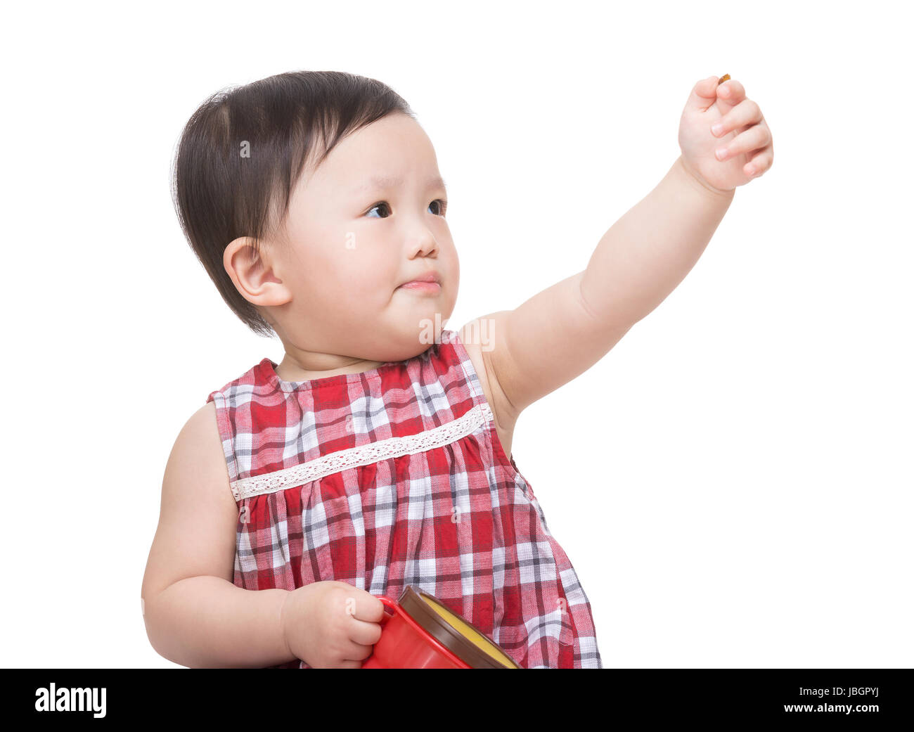 Asia little girl holding her snack box and hand up Stock Photo - Alamy