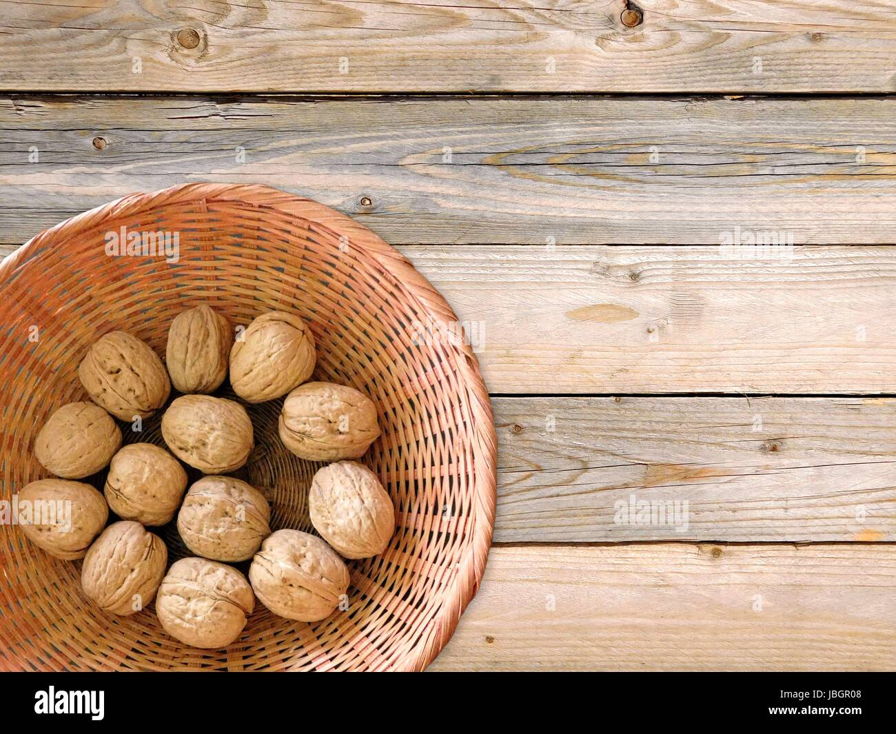 Nuts with shell on wooden background Stock Photo - Alamy