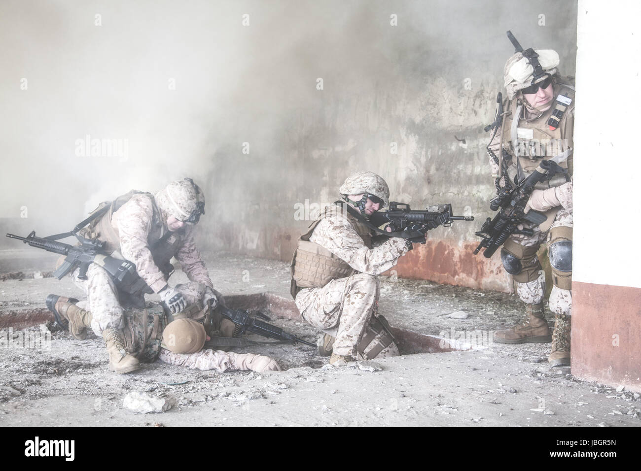 Squad of US marines in action in ruined building Stock Photo - Alamy
