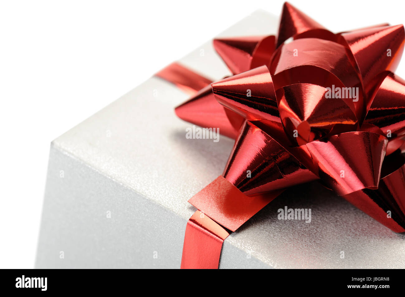 gift box with red ribbon on white background, closeup Stock Photo - Alamy