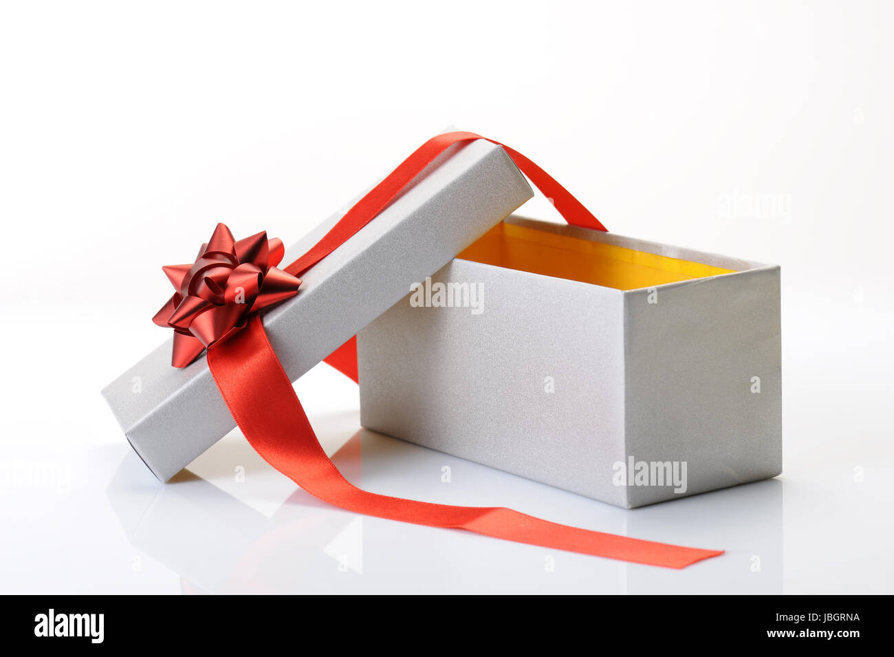open gift box with bow and red ribbon on white background Stock Photo ...