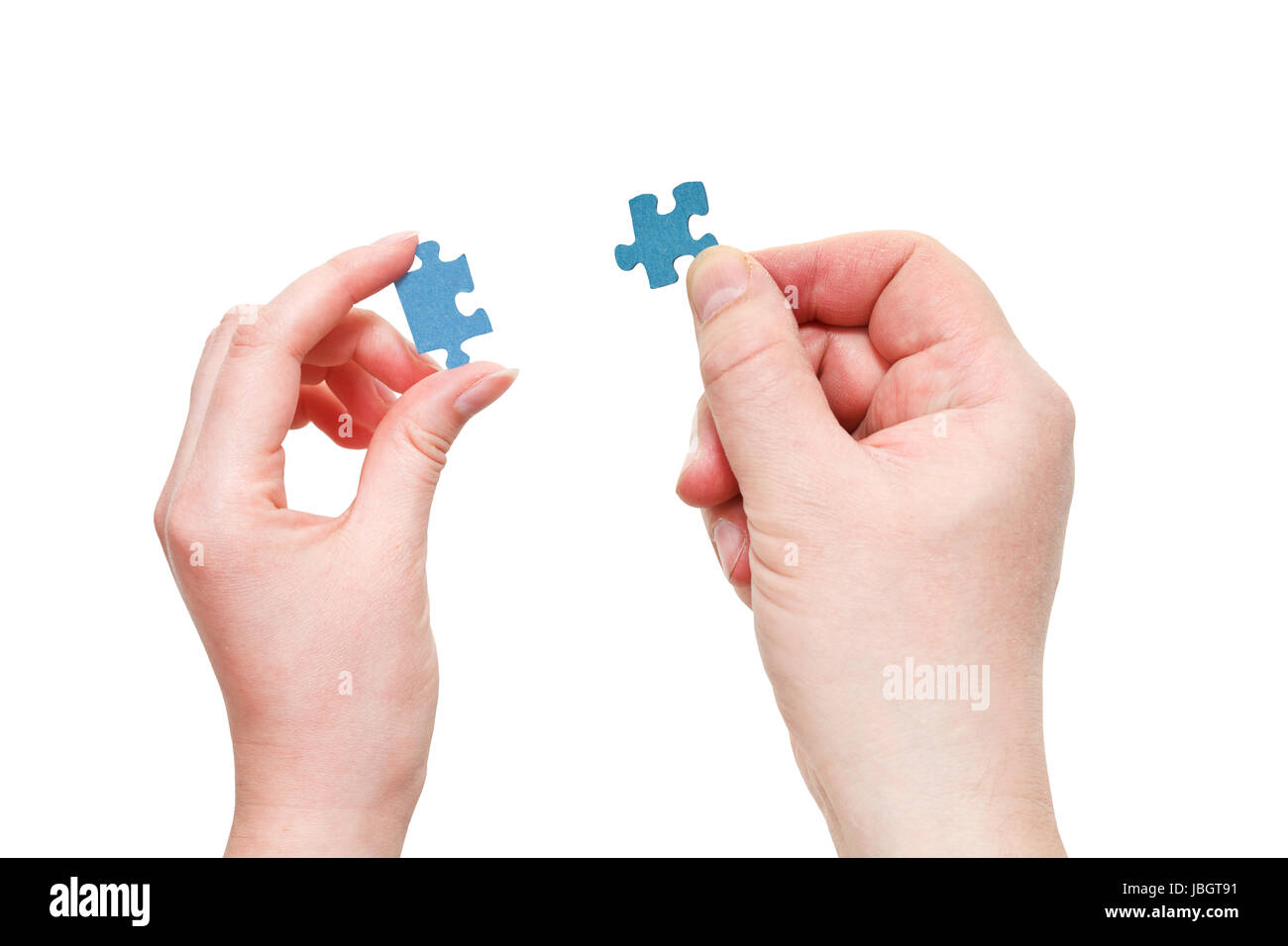 couple male and female hands with blue puzzle pieces isolated on white ...
