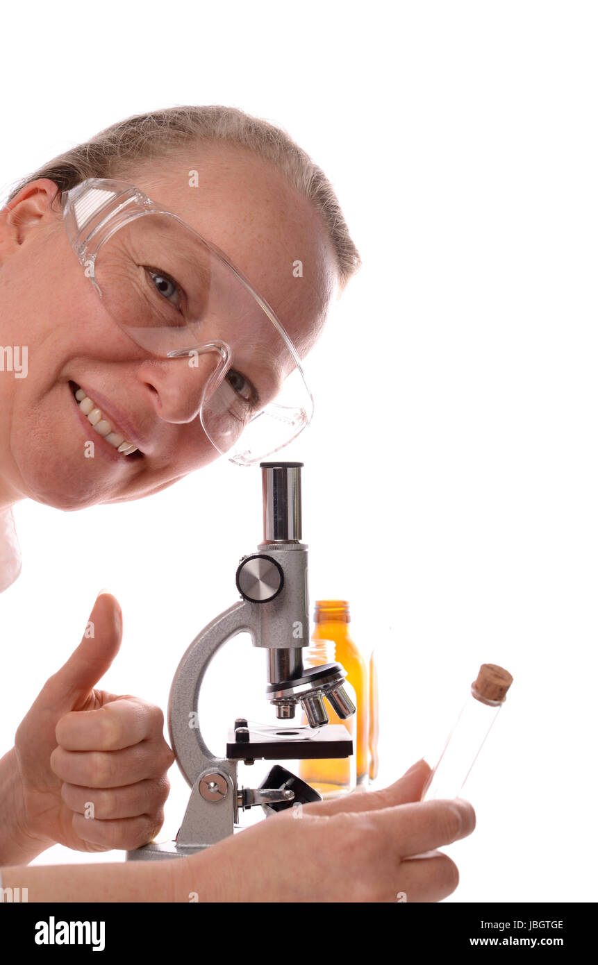 Female doctor with a microscope and thumb up Stock Photo - Alamy