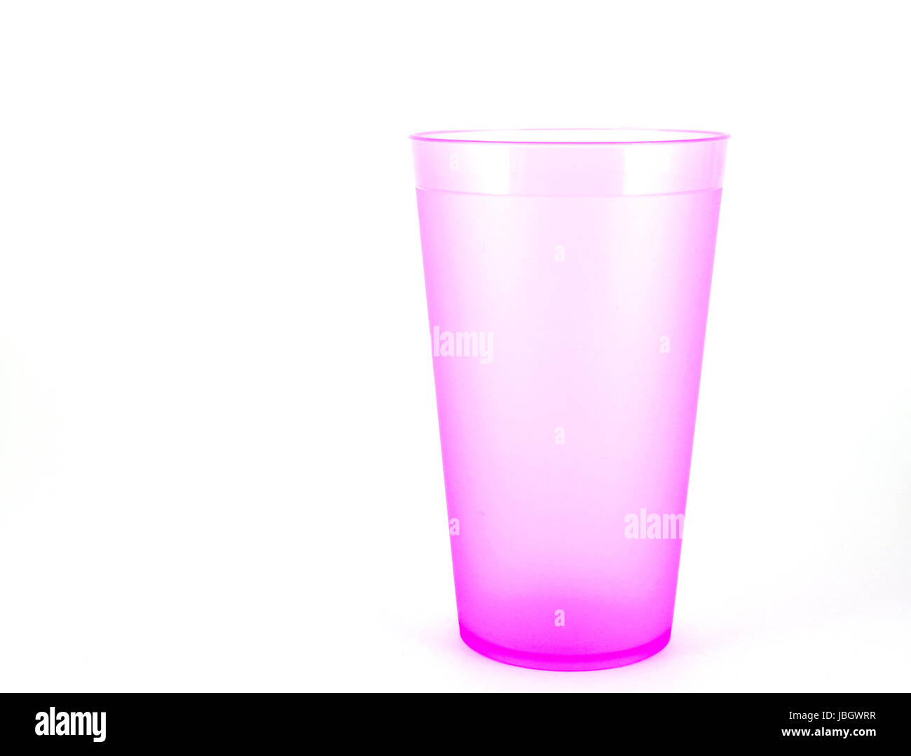 Pink plastic cup over white Stock Photo - Alamy