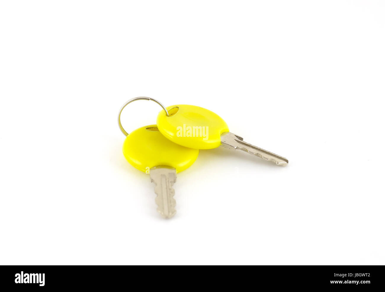 Two yellow keys over white Stock Photo - Alamy