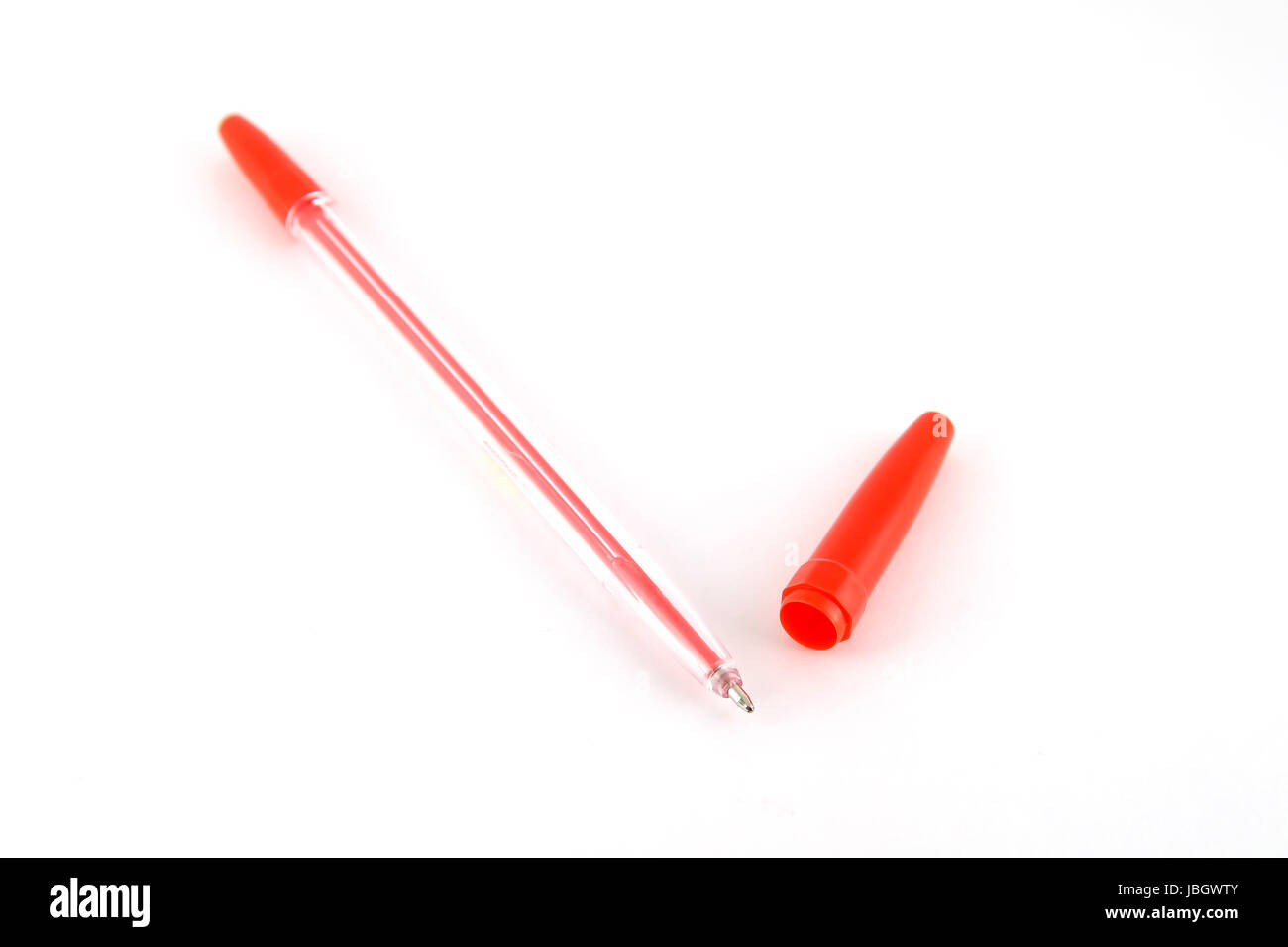 Red ball-point pen over white Stock Photo - Alamy
