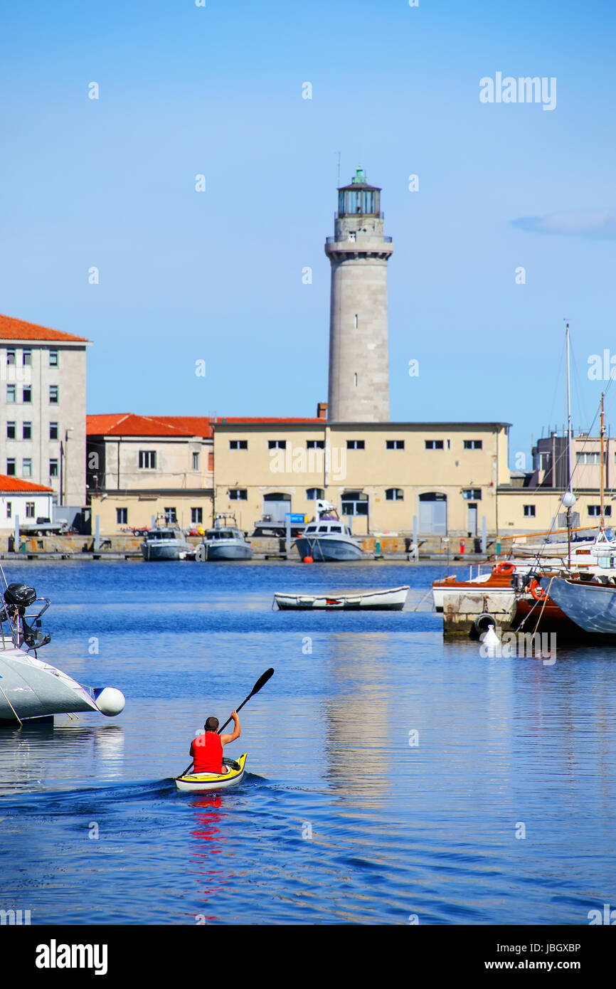 Harbor with lighthouse and boat hi-res stock photography and images - Alamy