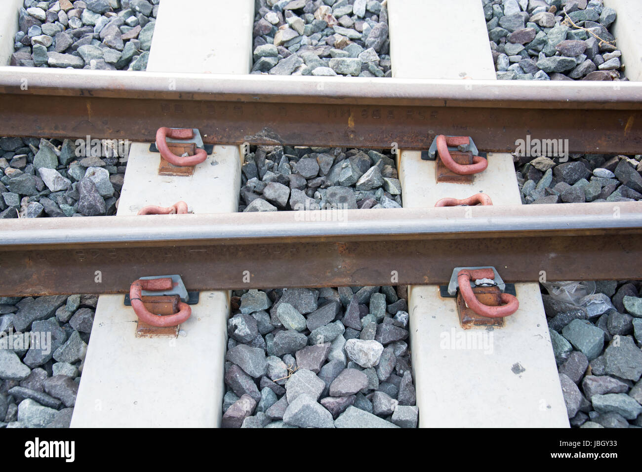 Steel support rails with concrete sleepers strewn with gravel Stock ...