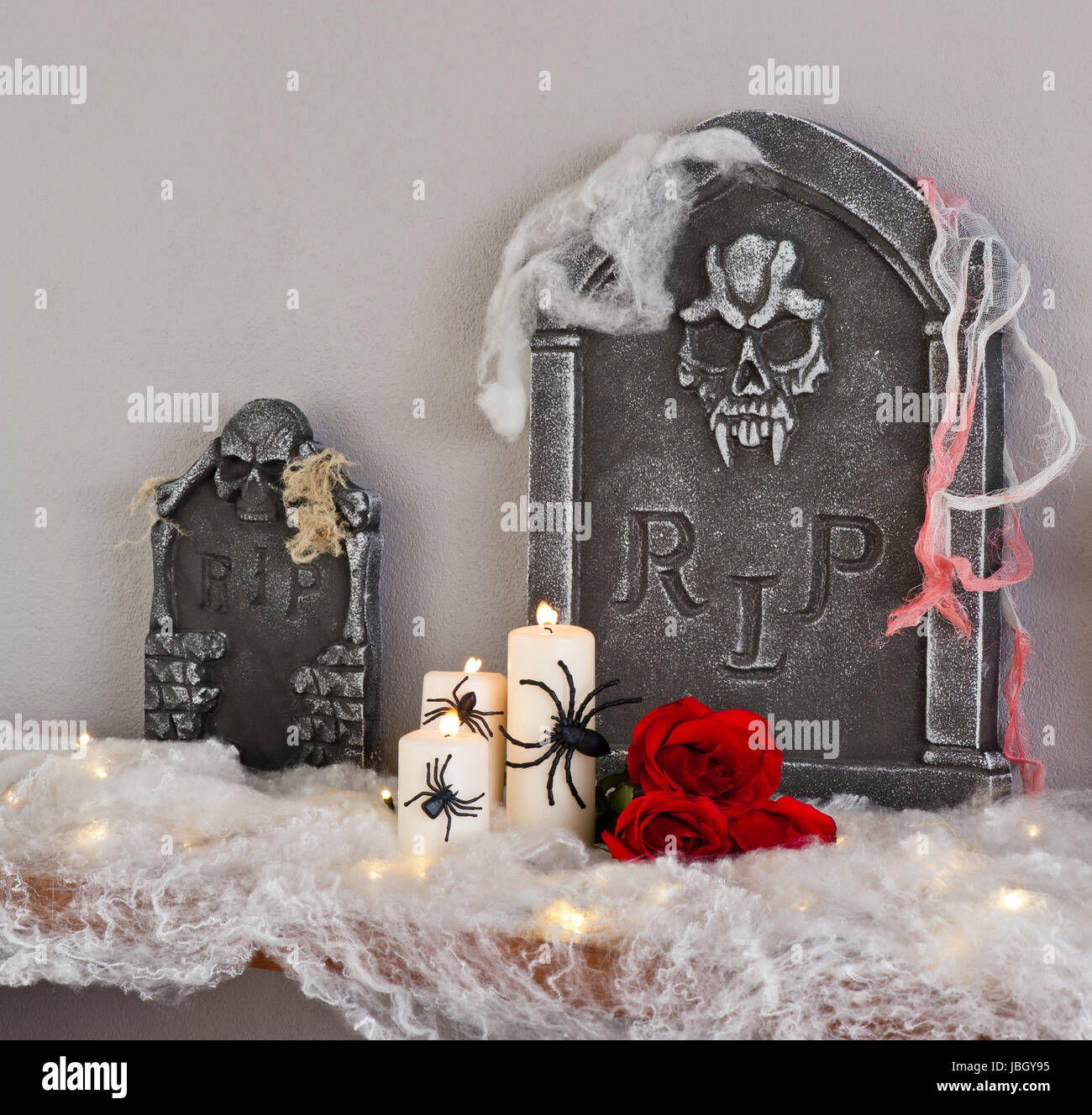 Candles in Halloween decoration and red roses Stock Photo - Alamy