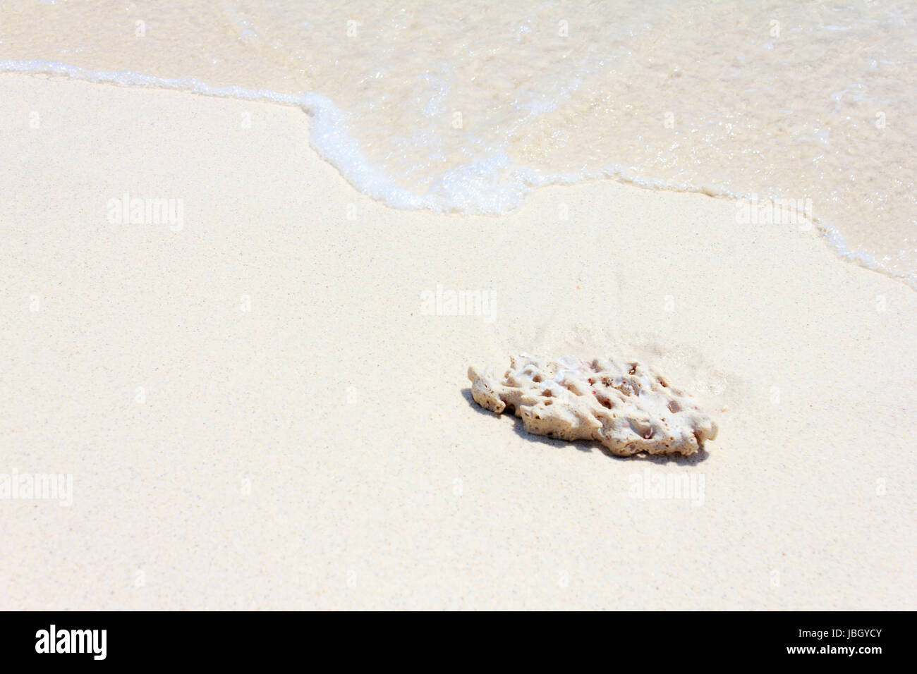 Blue water texture with small stones Stock Photo - Alamy
