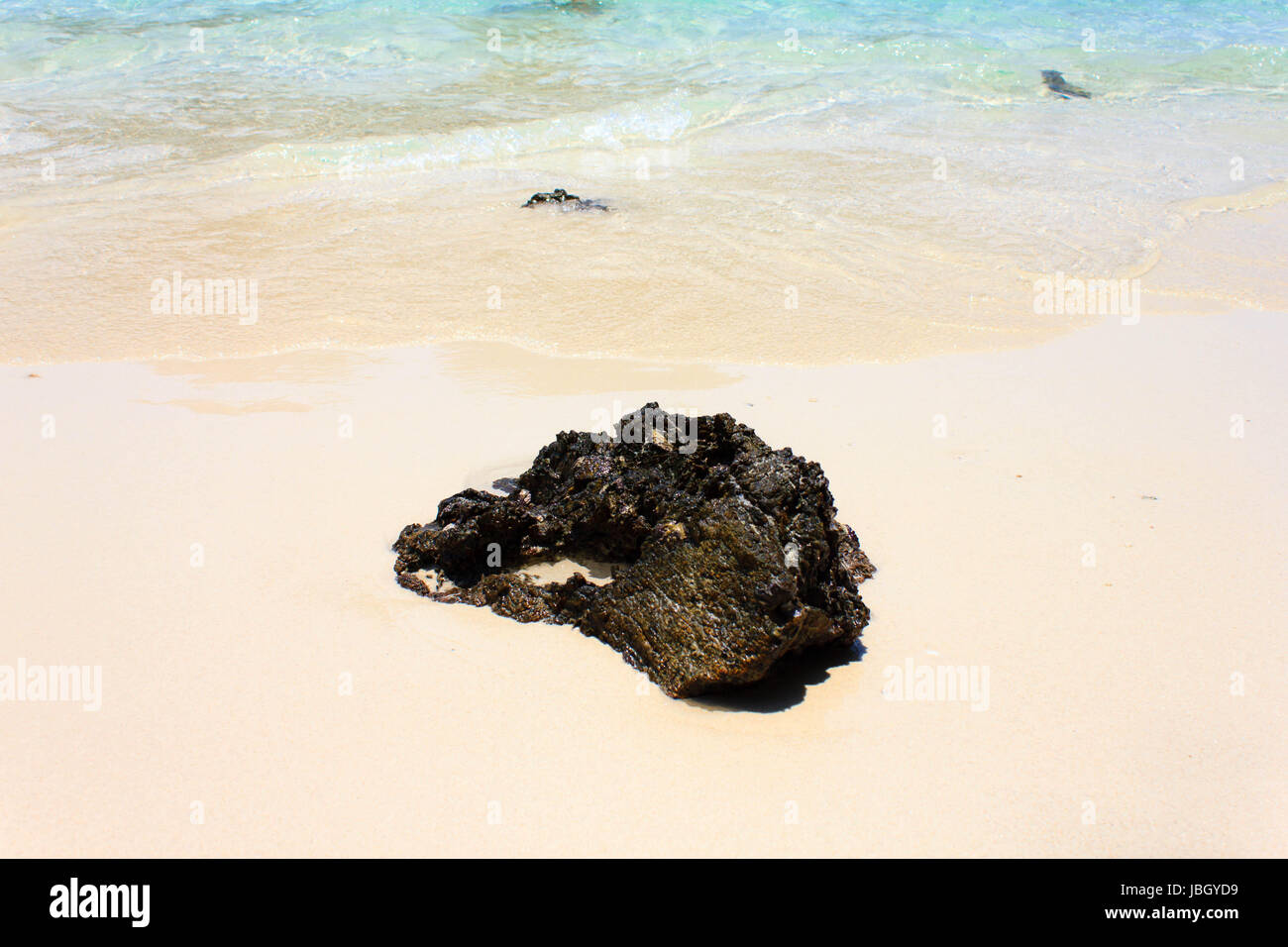 Blue water texture with small stones Stock Photo - Alamy