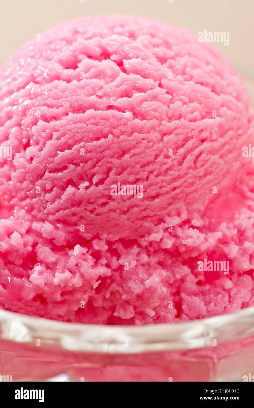 raspberry ice cream over a beige background Stock Photo - Alamy