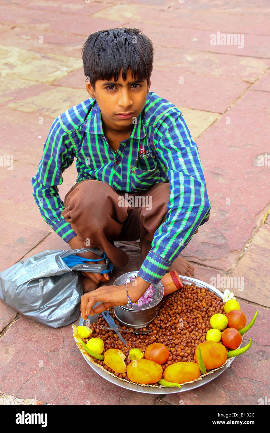 Local boy selling food in the courtyard of Jama Masjid in Fatehpur ...