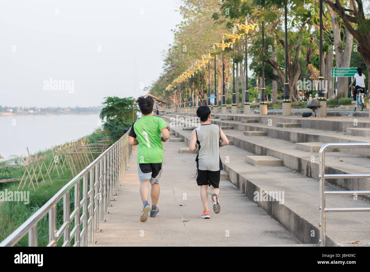 Two young athletes jogging. Running Riverside Stock Photo - Alamy