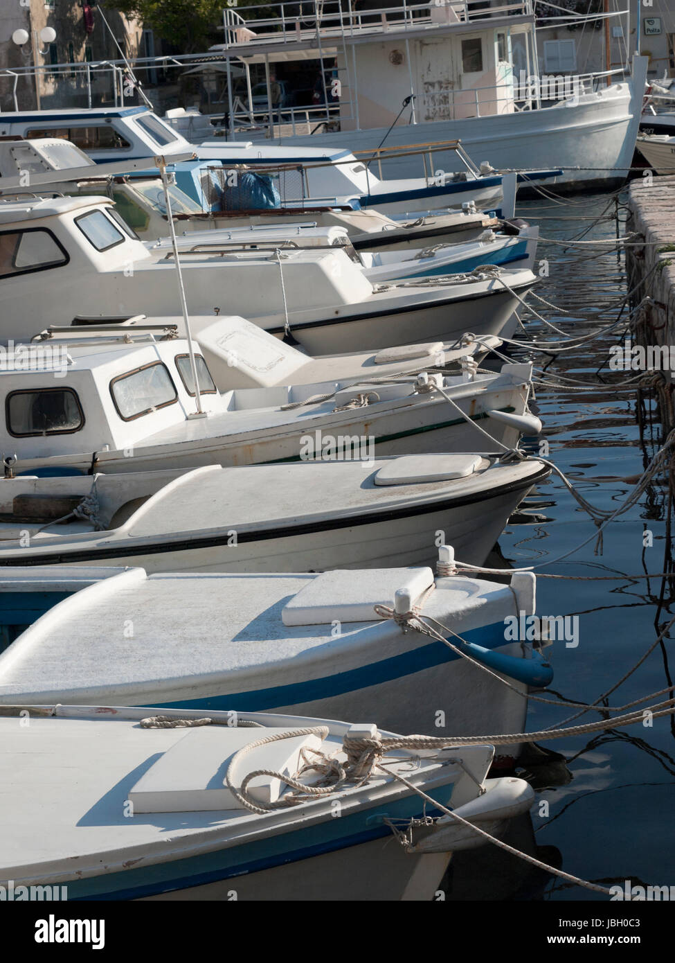 anchored fishing boats in the port Stock Photo - Alamy