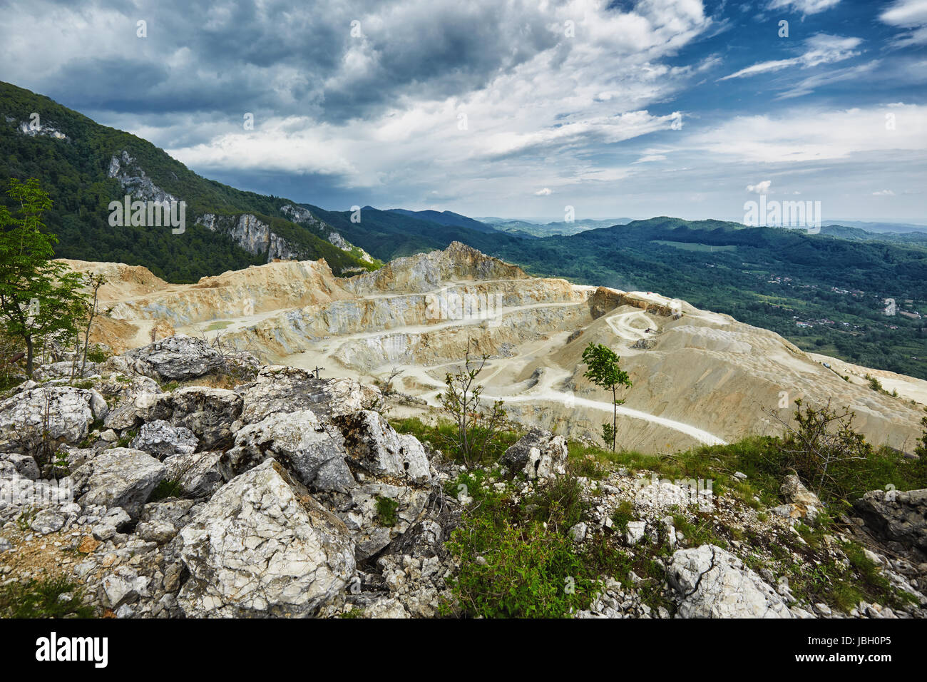 Landscape with a large stone quarry in full development Stock Photo - Alamy