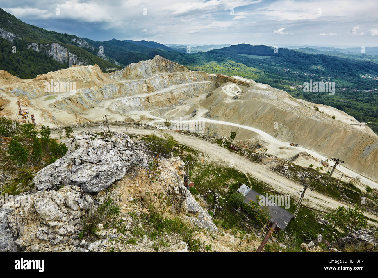 Landscape with a large stone quarry in full development Stock Photo - Alamy