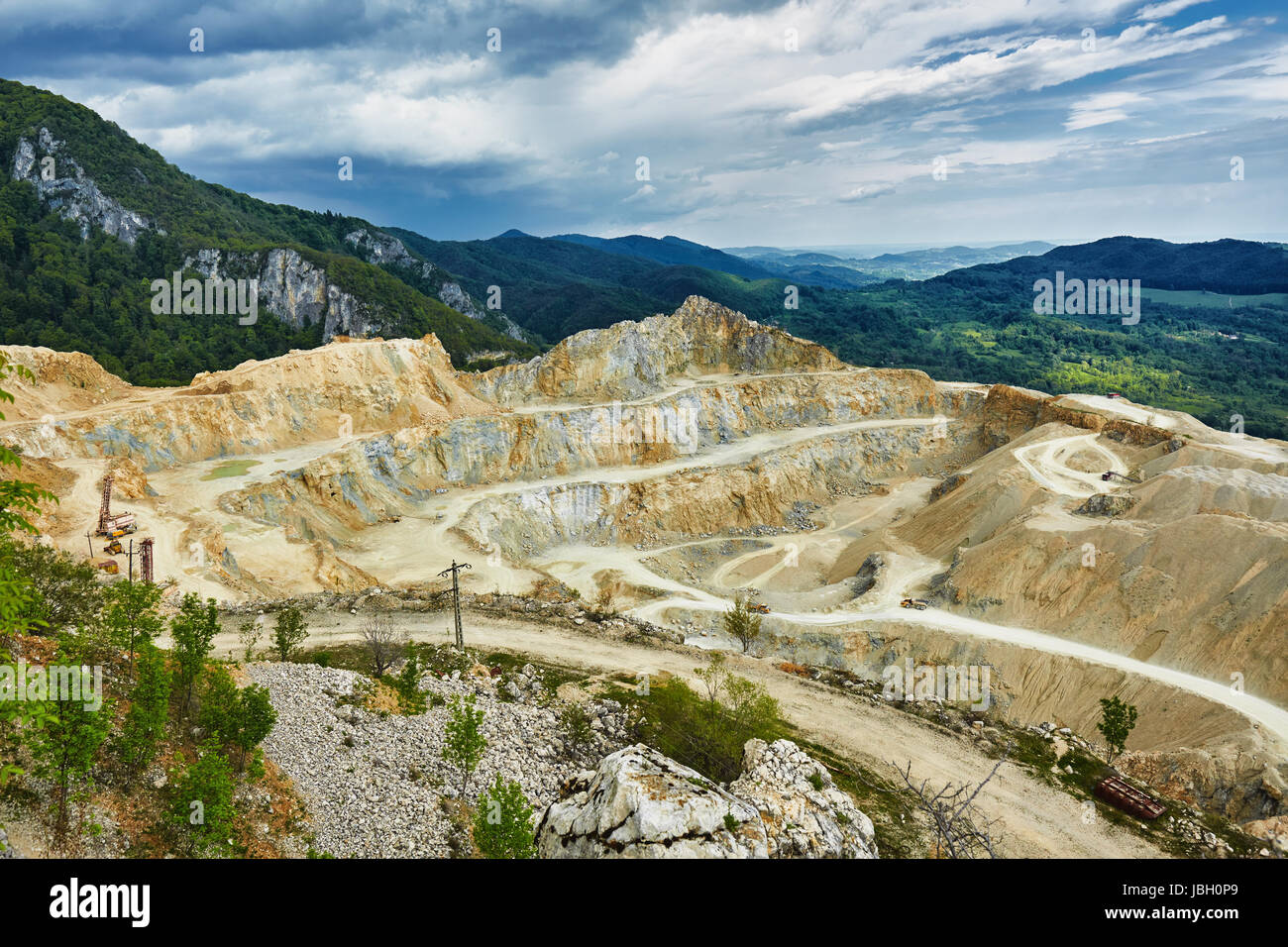 Landscape with a large stone quarry in full development Stock Photo - Alamy