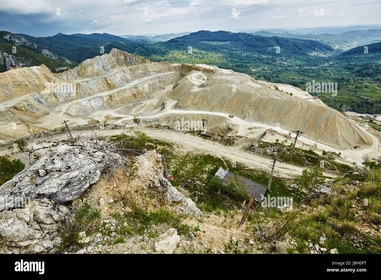 Landscape with a large stone quarry in full development Stock Photo - Alamy