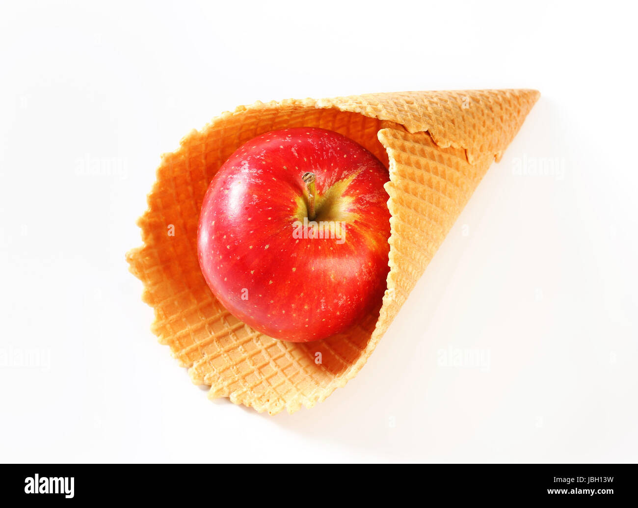Fresh red apple in waffle cornet Stock Photo - Alamy