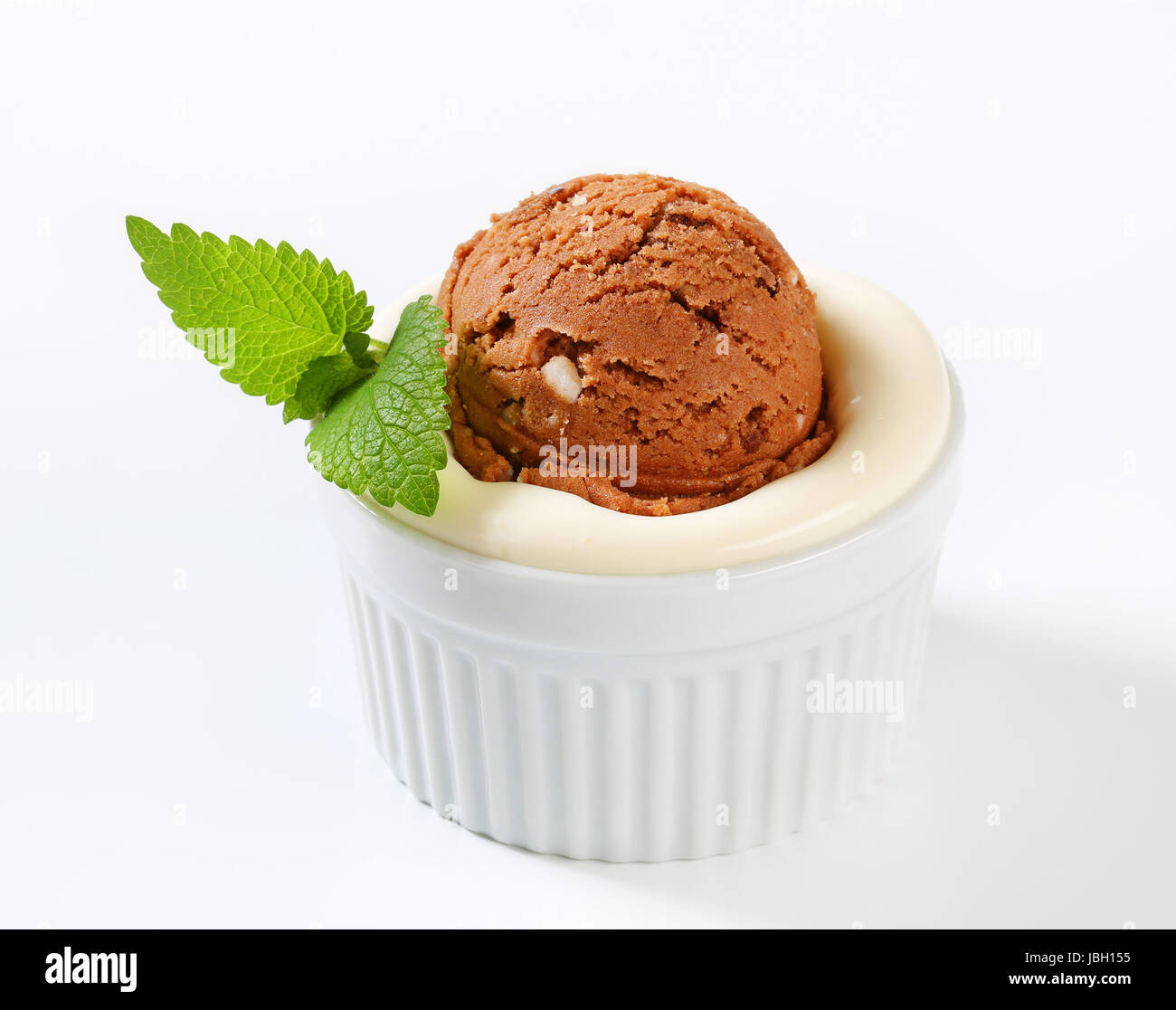 Pudding and scoop of ice cream in ramekin Stock Photo - Alamy