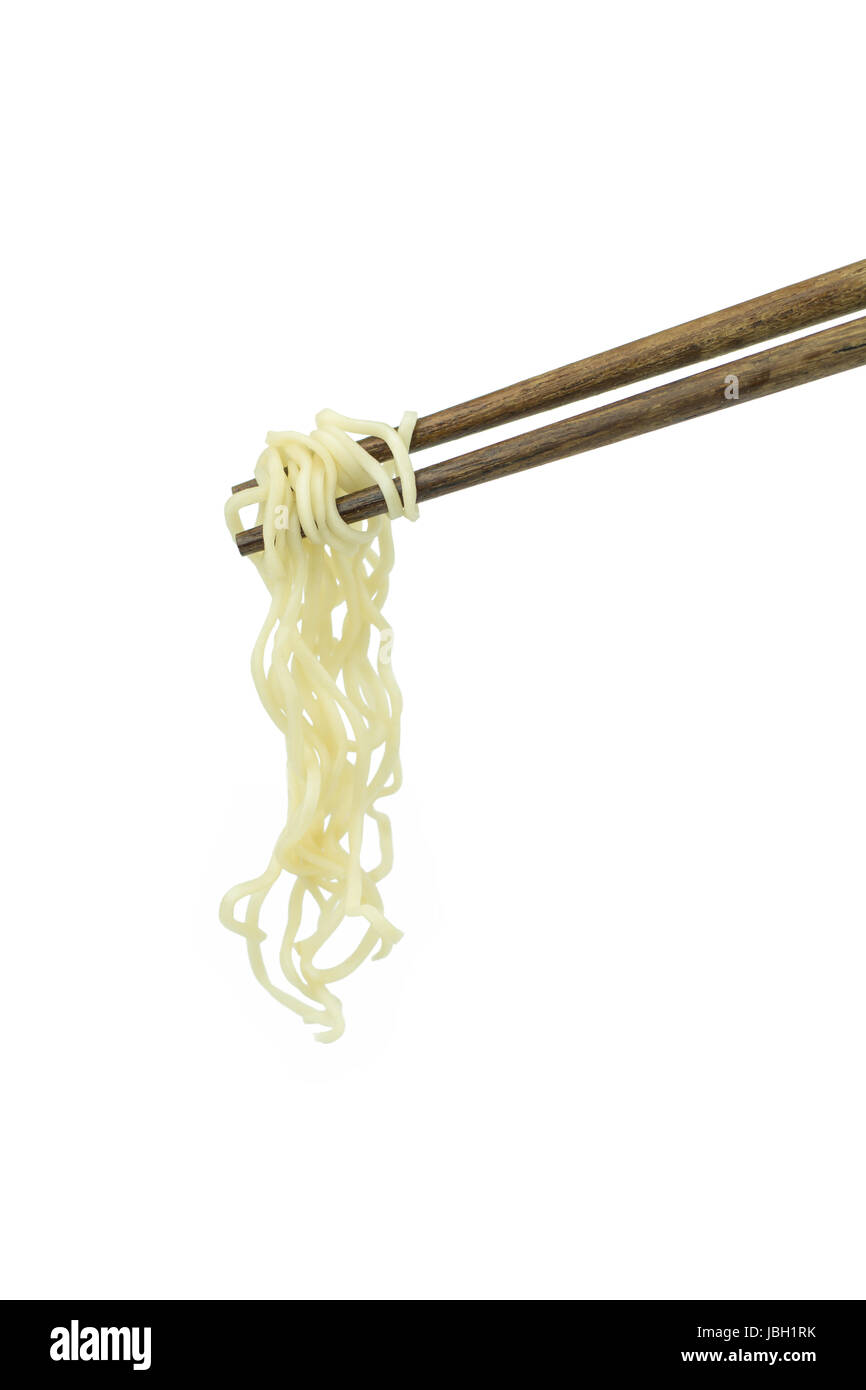 chopsticks holding oriental noodles isolated on a white background ...