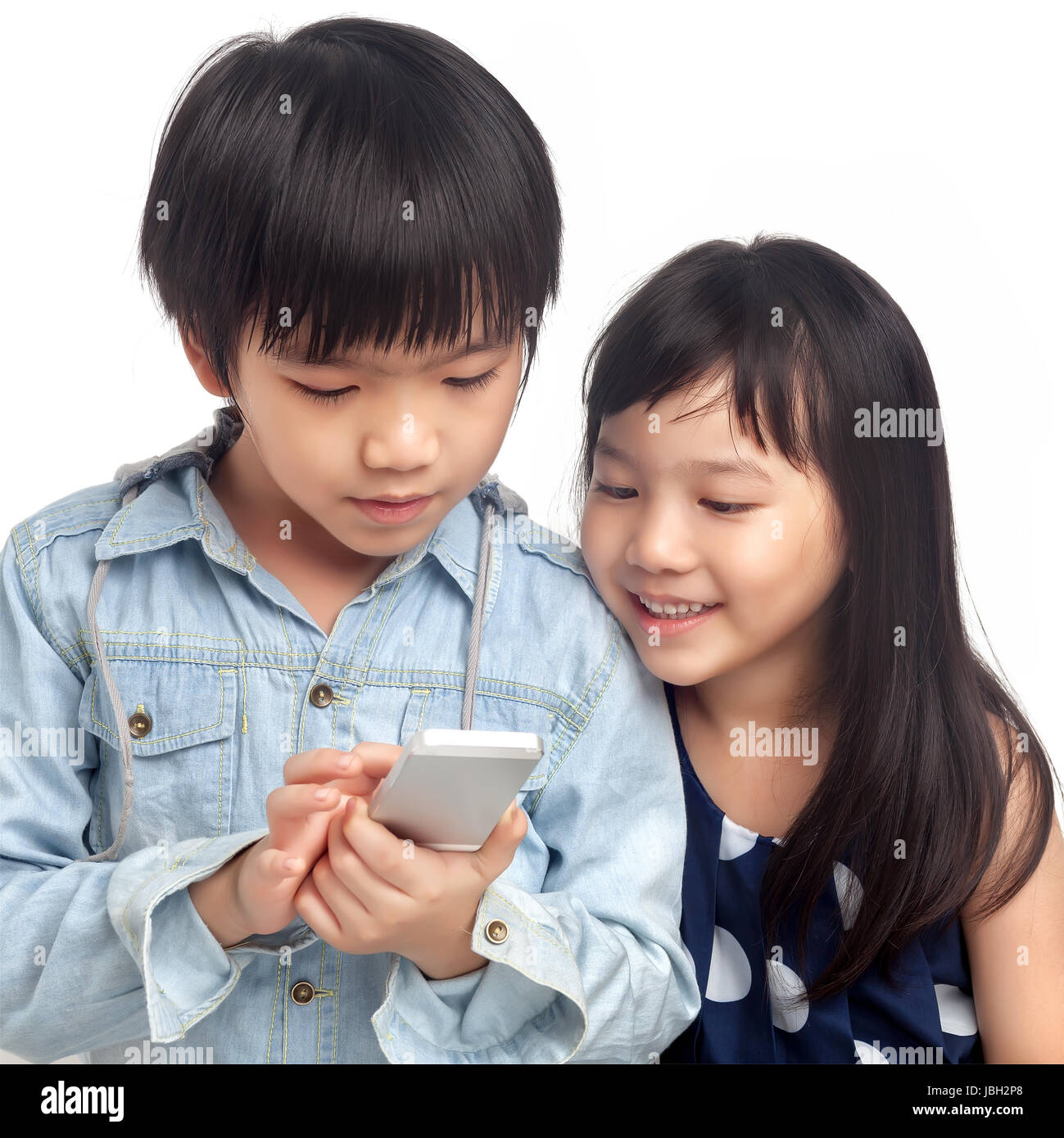 Kids playing on smartphone on white background Stock Photo - Alamy