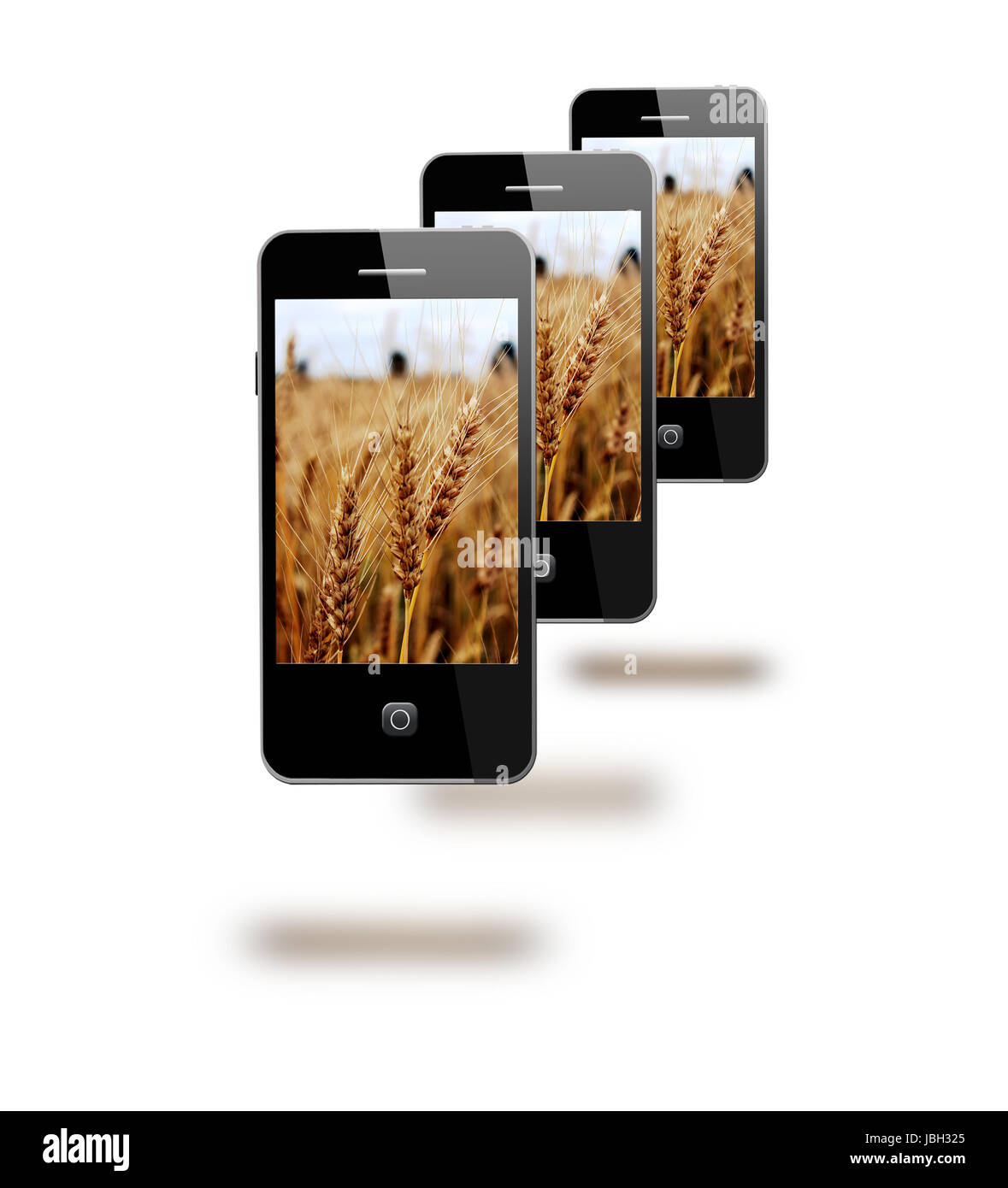 modern mobile phones with images os fields of wheat Stock Photo - Alamy