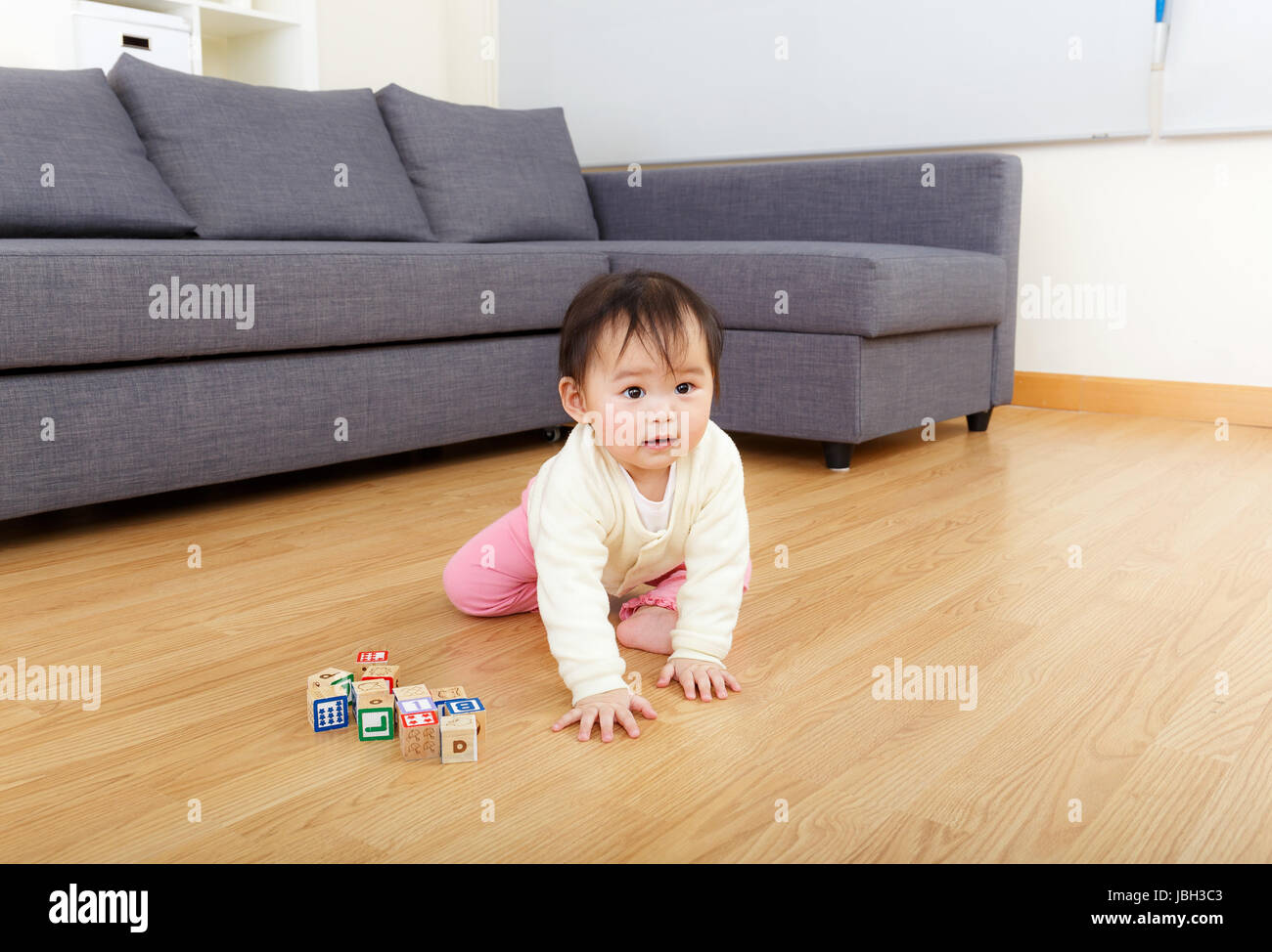 Asia baby girl creeping at home Stock Photo - Alamy