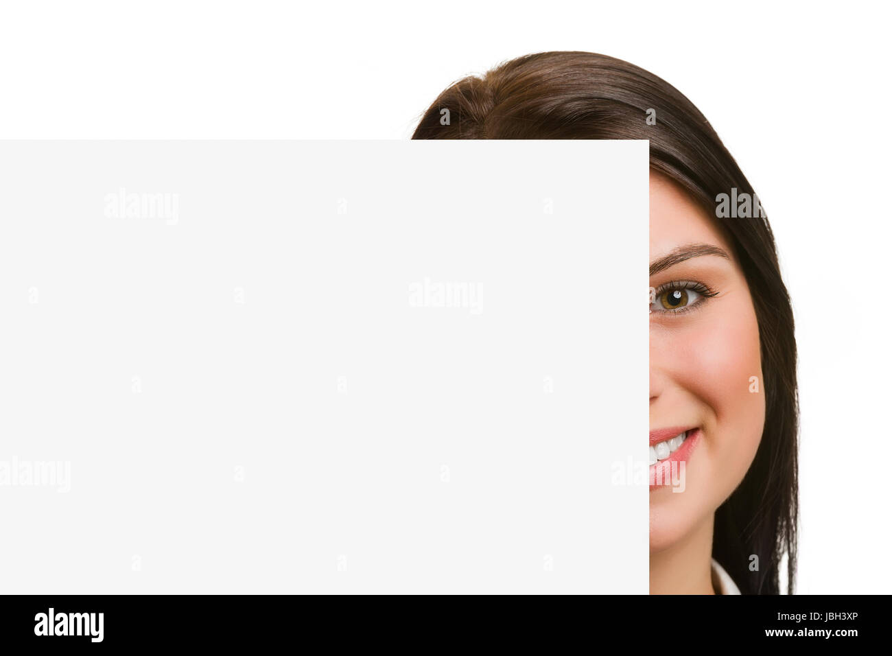 Portrait of half face smiling young woman showing blank signboard Stock ...