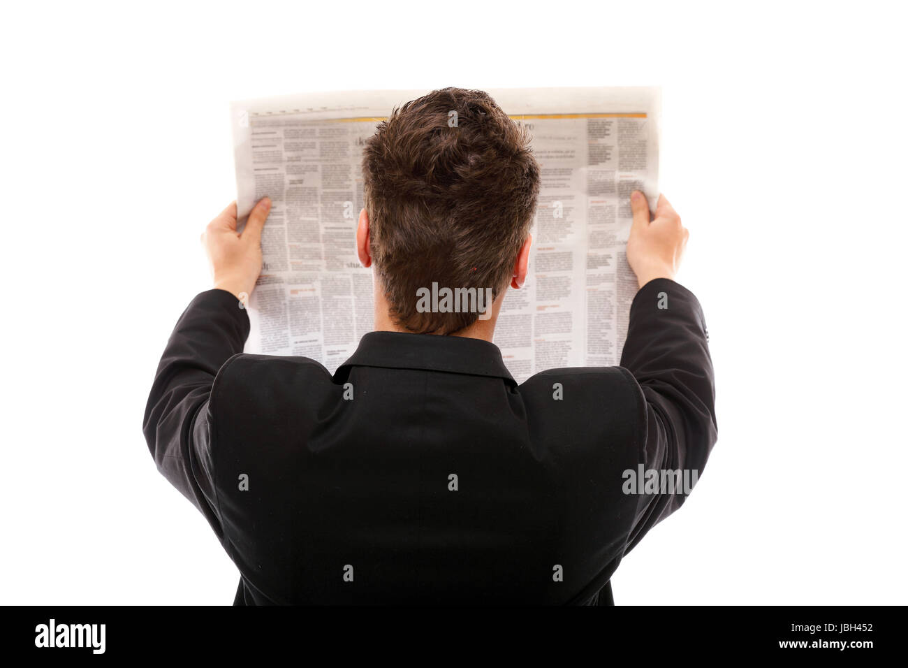 Businessman view from behind reading a newspaper isolated on white ...