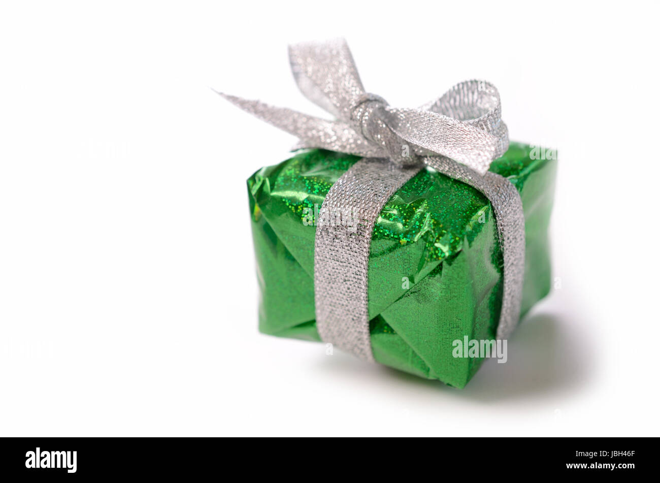 Green gift box with a bow Stock Photo - Alamy
