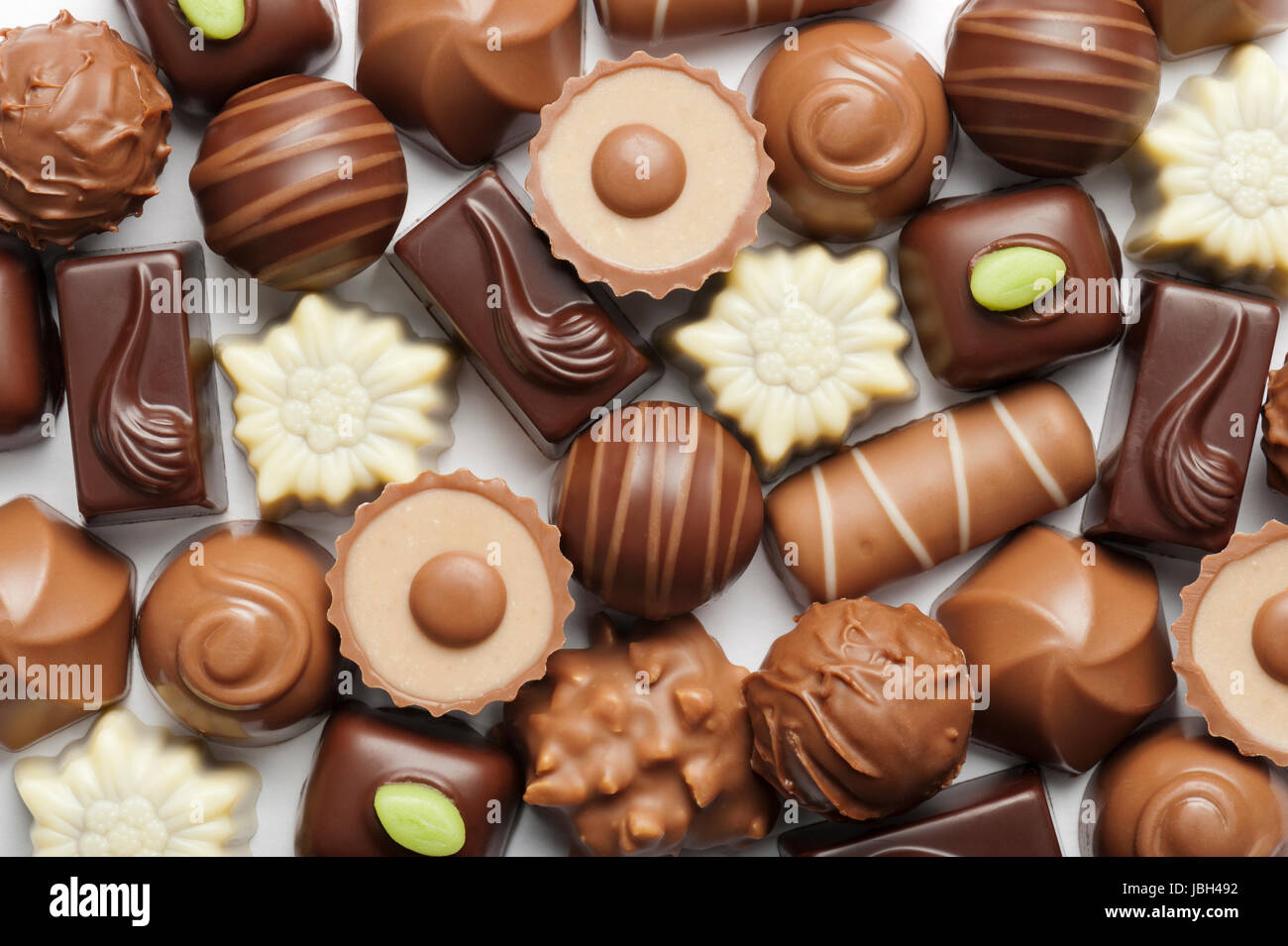 assorted chocolates confectionery on white background Stock Photo - Alamy