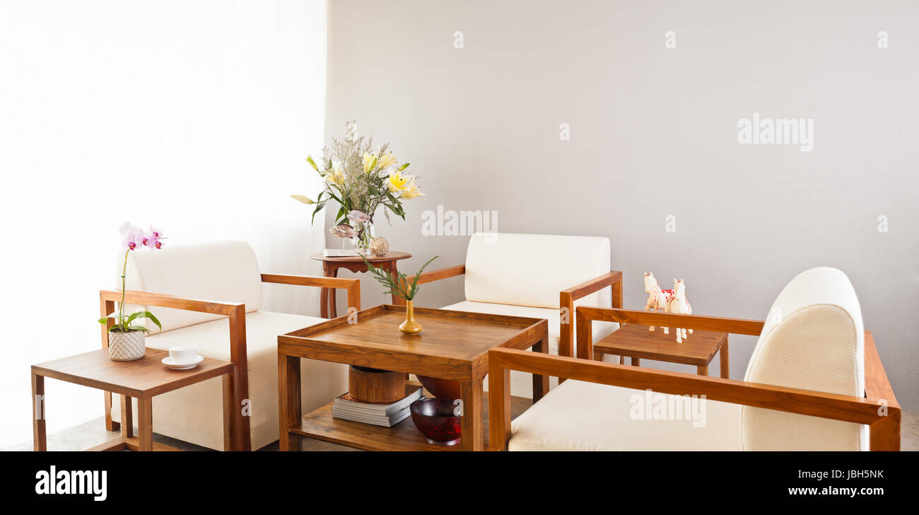 Three bright white seater in lounge area Stock Photo - Alamy