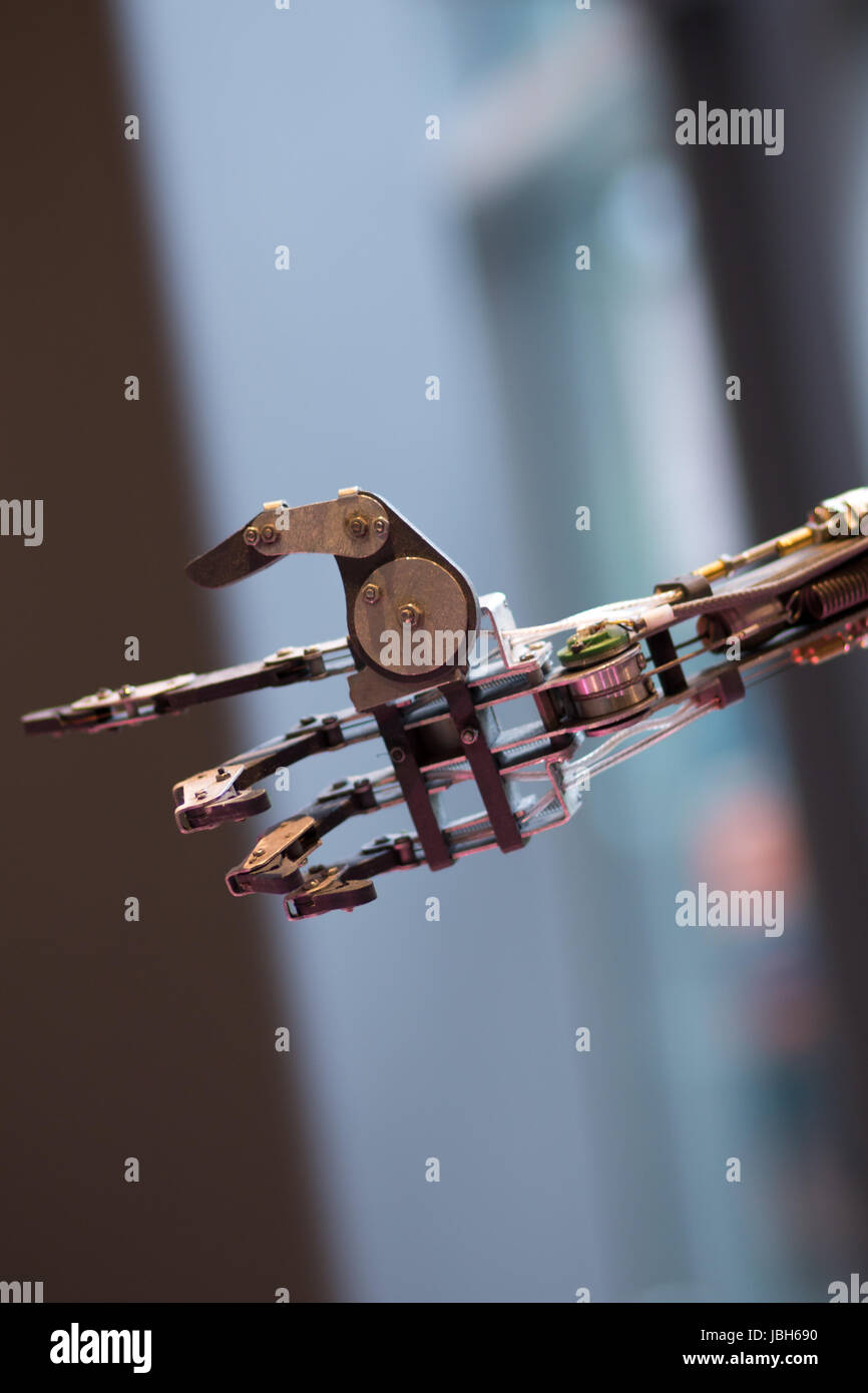 Future technology in black prosthetic hand with a blurred backgound ...
